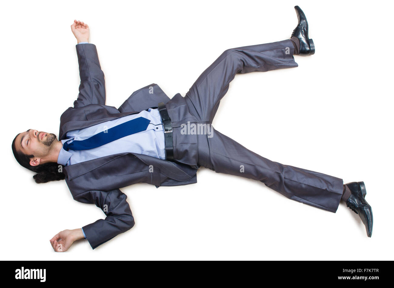 Businessman on the floor isolated on white Stock Photo - Alamy