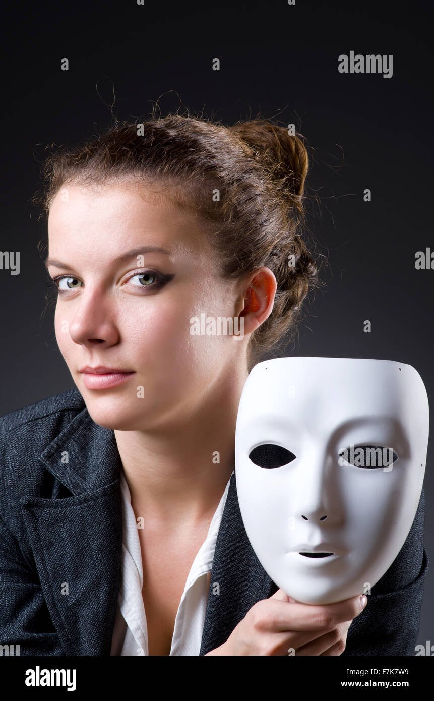 Woman with mask in hypocrisy concept Stock Photo - Alamy