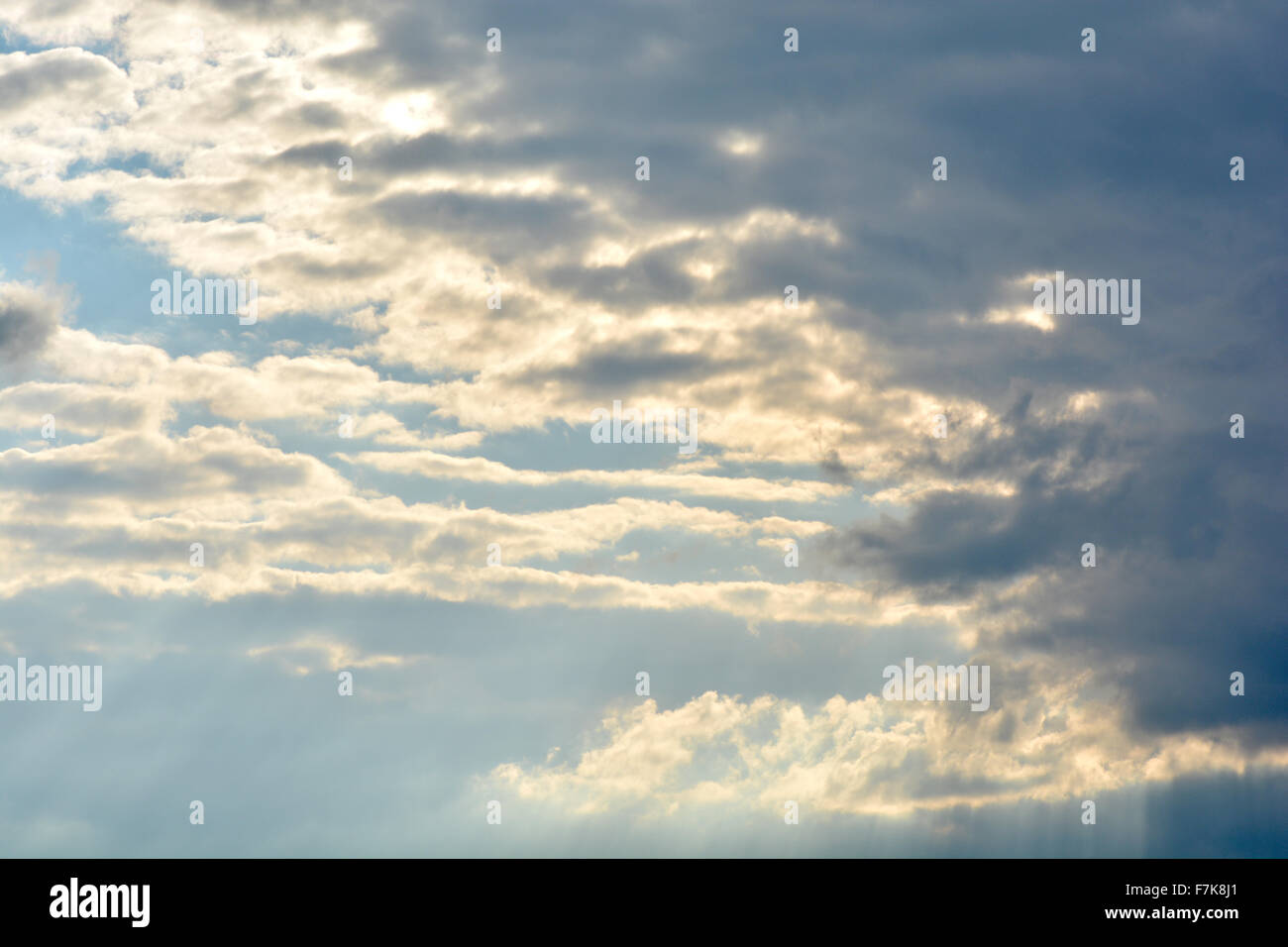 Overcast day sun beam through the clouds Stock Photo - Alamy