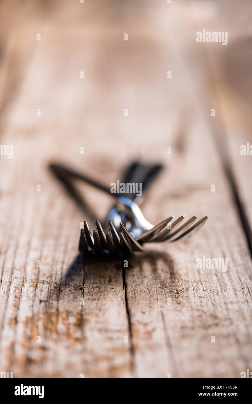 Forks on a old wooden table close up shot Stock Photo - Alamy