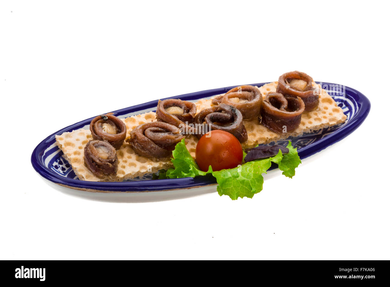 Anchovy snack with salad and tomato Stock Photo - Alamy