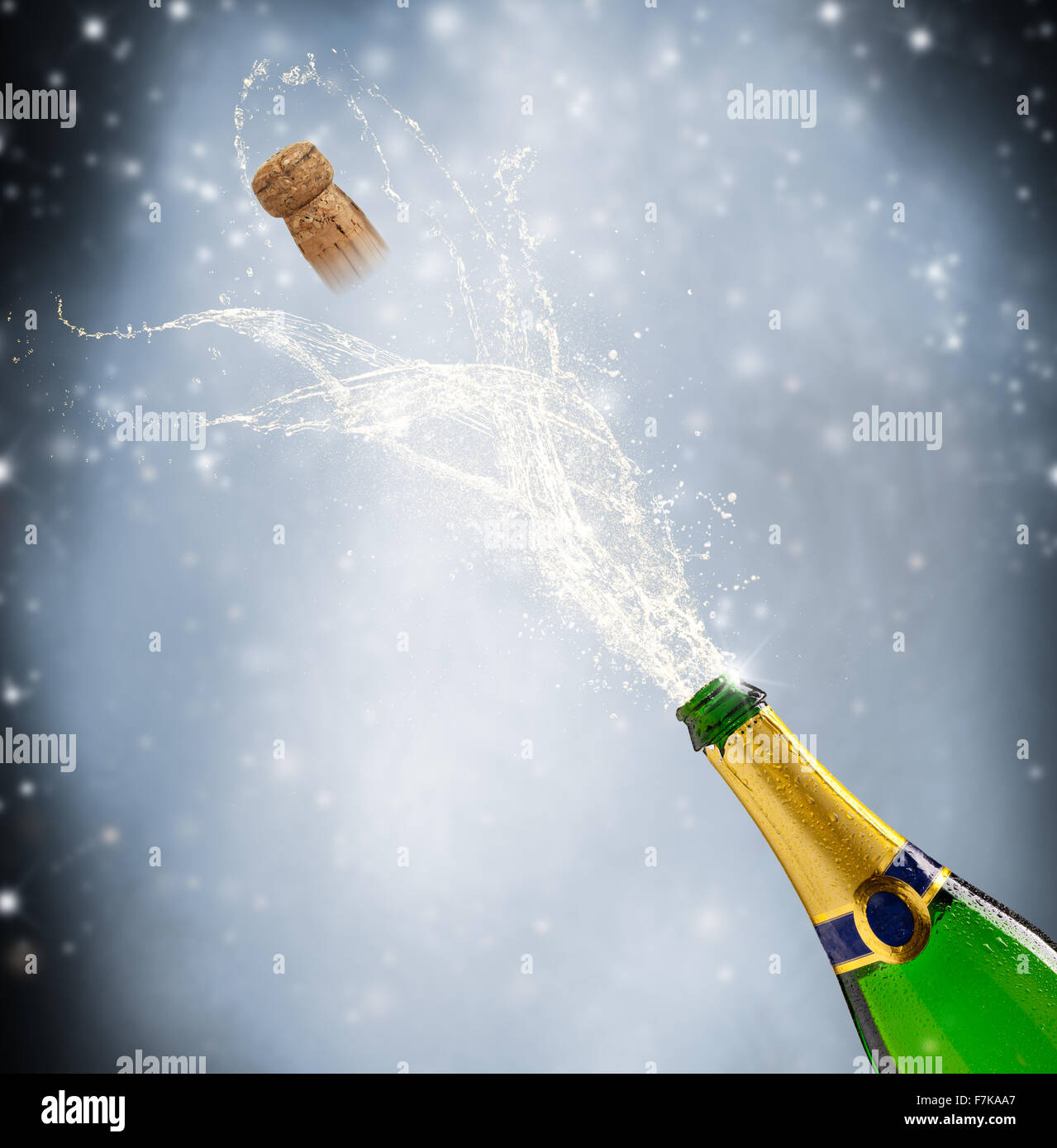 Celebration theme with splashing champagne on black Stock Photo - Alamy