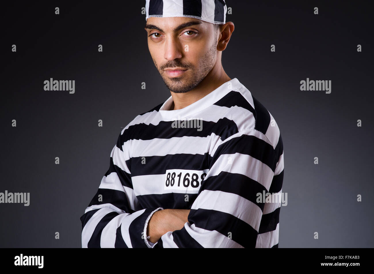 Angry prison inmate in dark room Stock Photo - Alamy