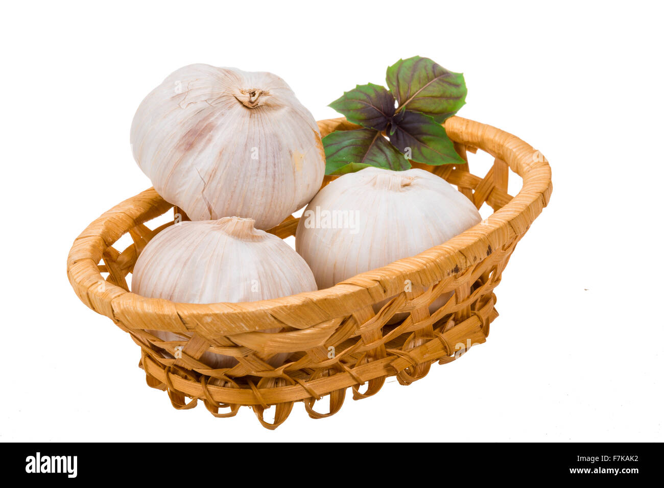 Ripe garlic with basil leaf Stock Photo - Alamy