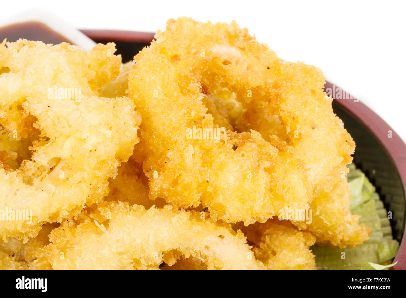 Deep batter fried squid rings calamari with green salad Stock Photo - Alamy
