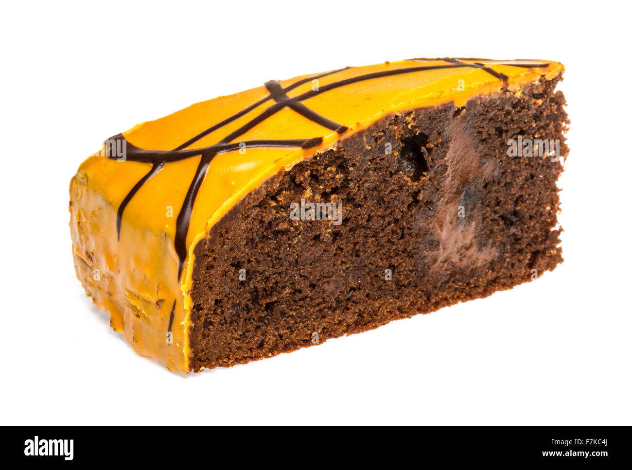 Piece of chocolate cake with icing on white isolated background Stock ...