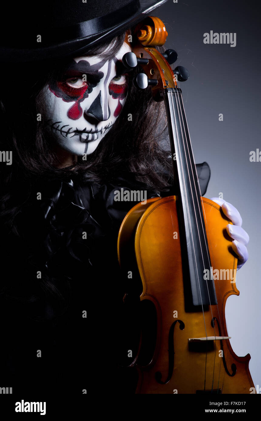 Monster playing violin in dark room Stock Photo - Alamy