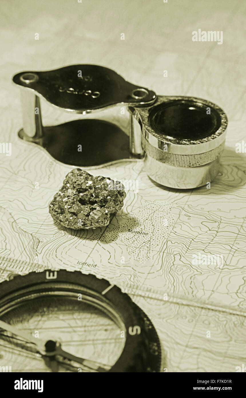 Mining exploration concept image with magnifier, mineral sample, and ...