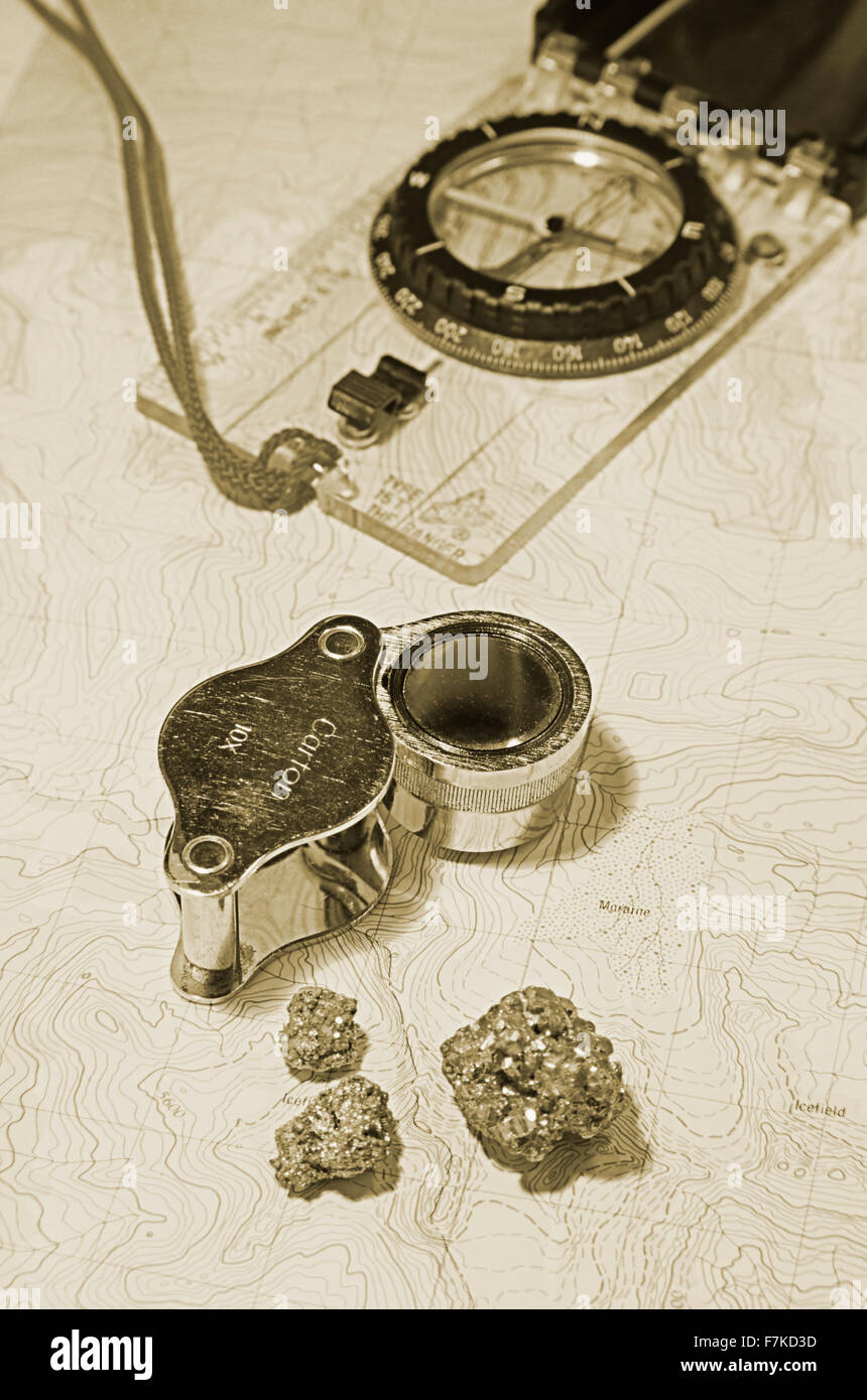 Mining exploration concept image with magnifier, mineral sample, and ...