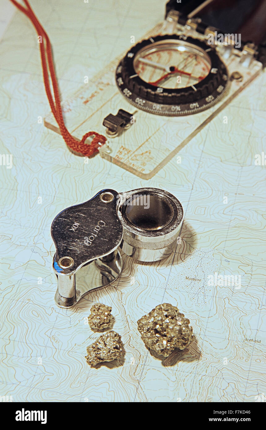 Mining exploration concept image with magnifier, mineral sample, and ...