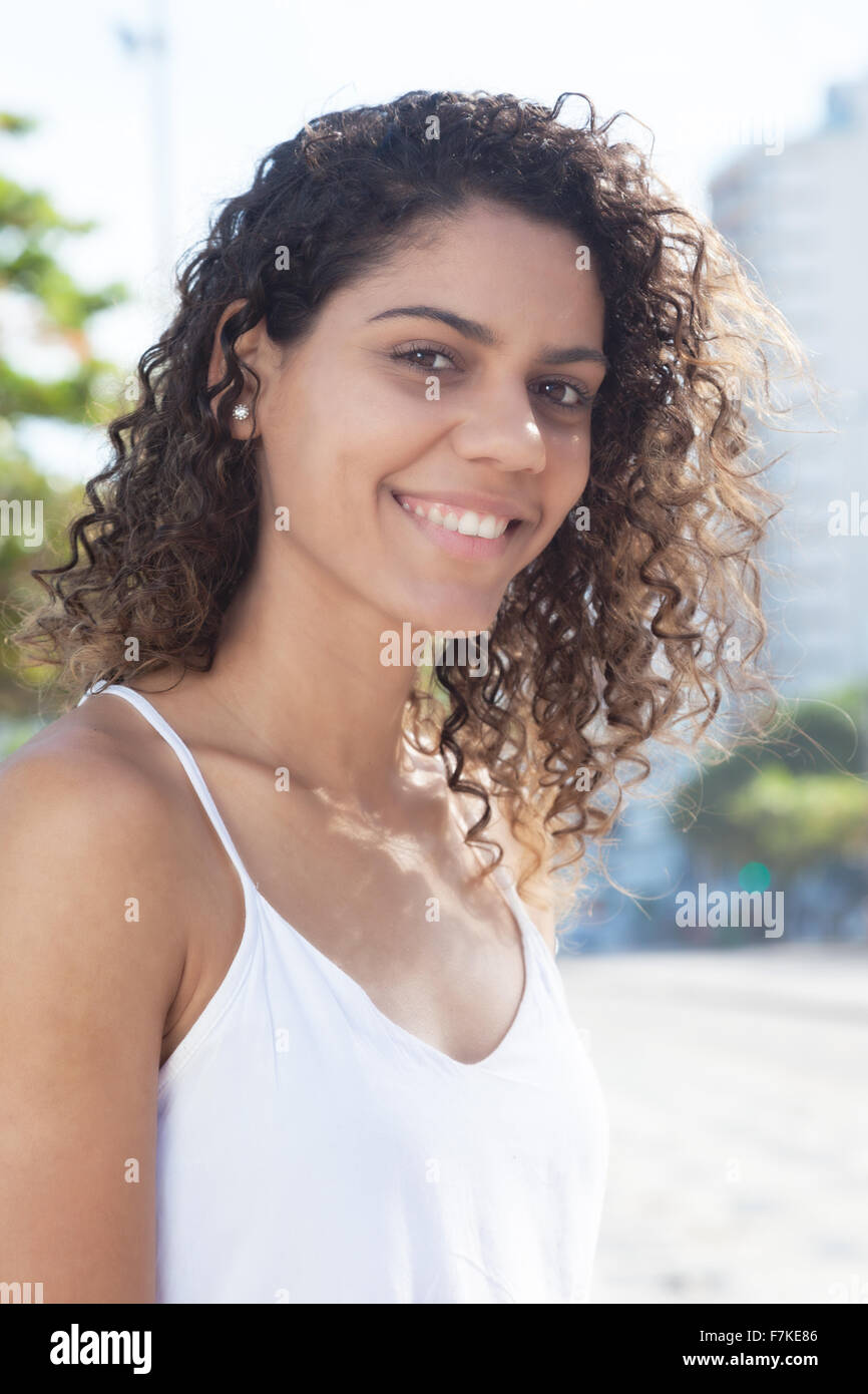 Portrait of latin woman outside in a city of latin america Stock Photo ...