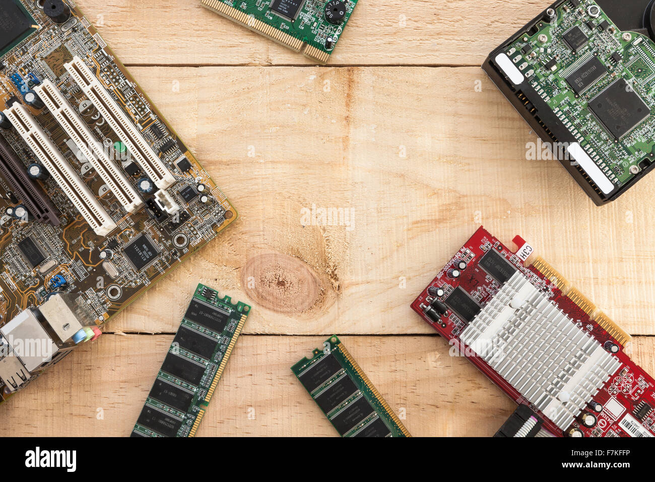 Motherboard and pc components over a wood background for a IOT or ...