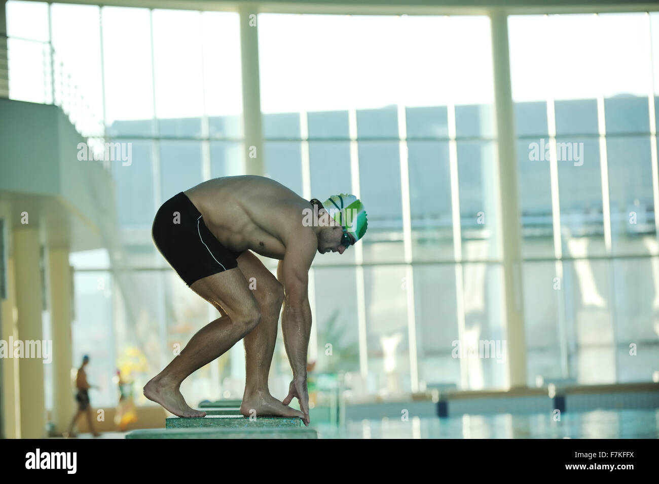 start position race concept with fit swimmer on swimming pool Stock ...