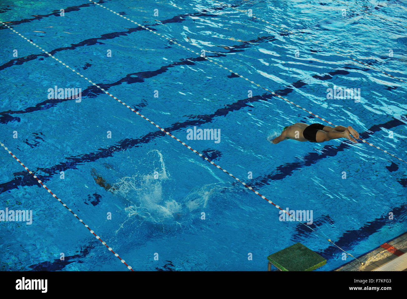 start position race concept with fit swimmer on swimming pool Stock ...