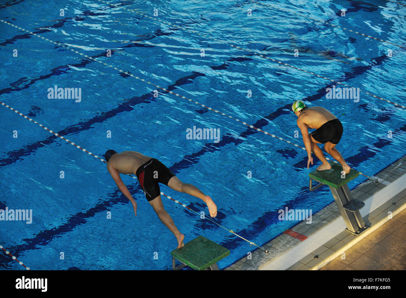 start position race concept with fit swimmer on swimming pool Stock ...