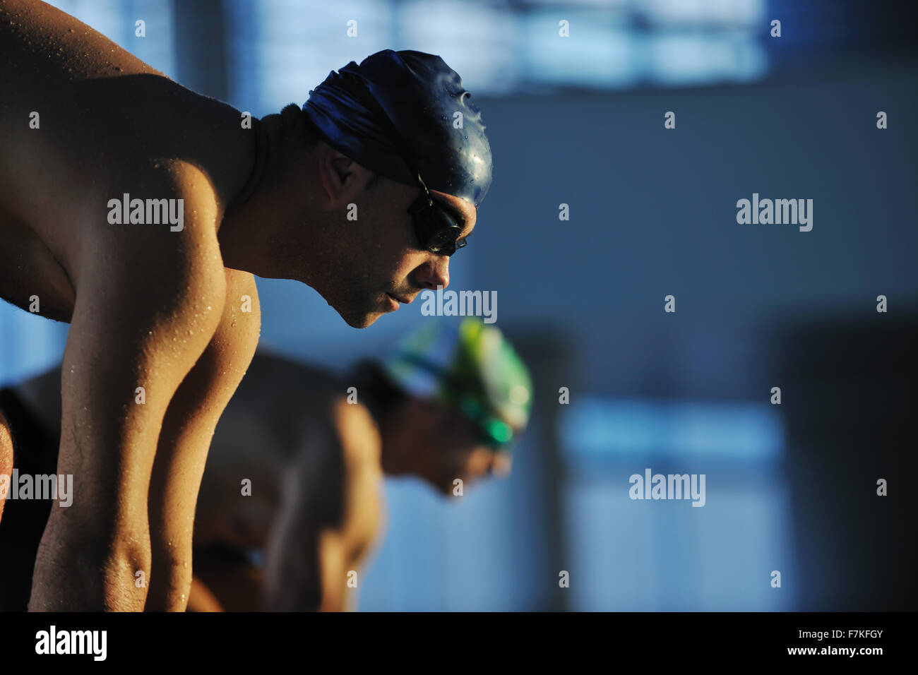 start position race concept with fit swimmer on swimming pool Stock ...