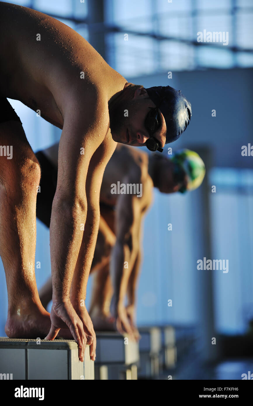 start position race concept with fit swimmer on swimming pool Stock ...