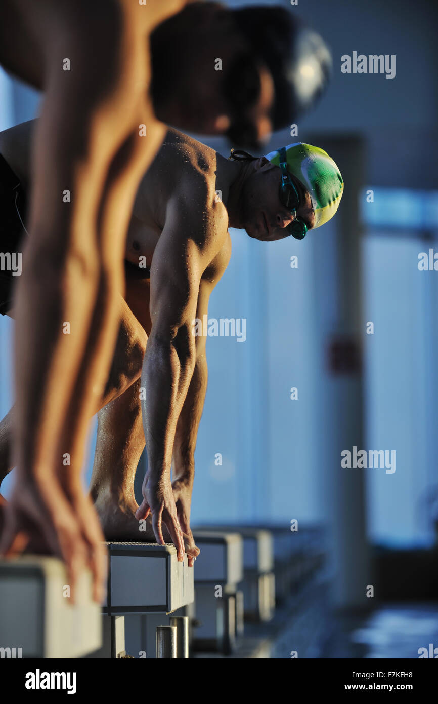 start position race concept with fit swimmer on swimming pool Stock ...
