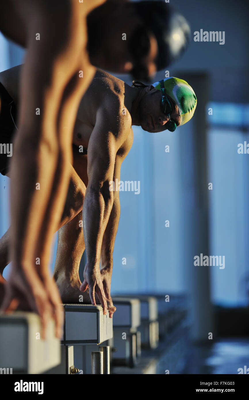 start position race concept with fit swimmer on swimming pool Stock ...
