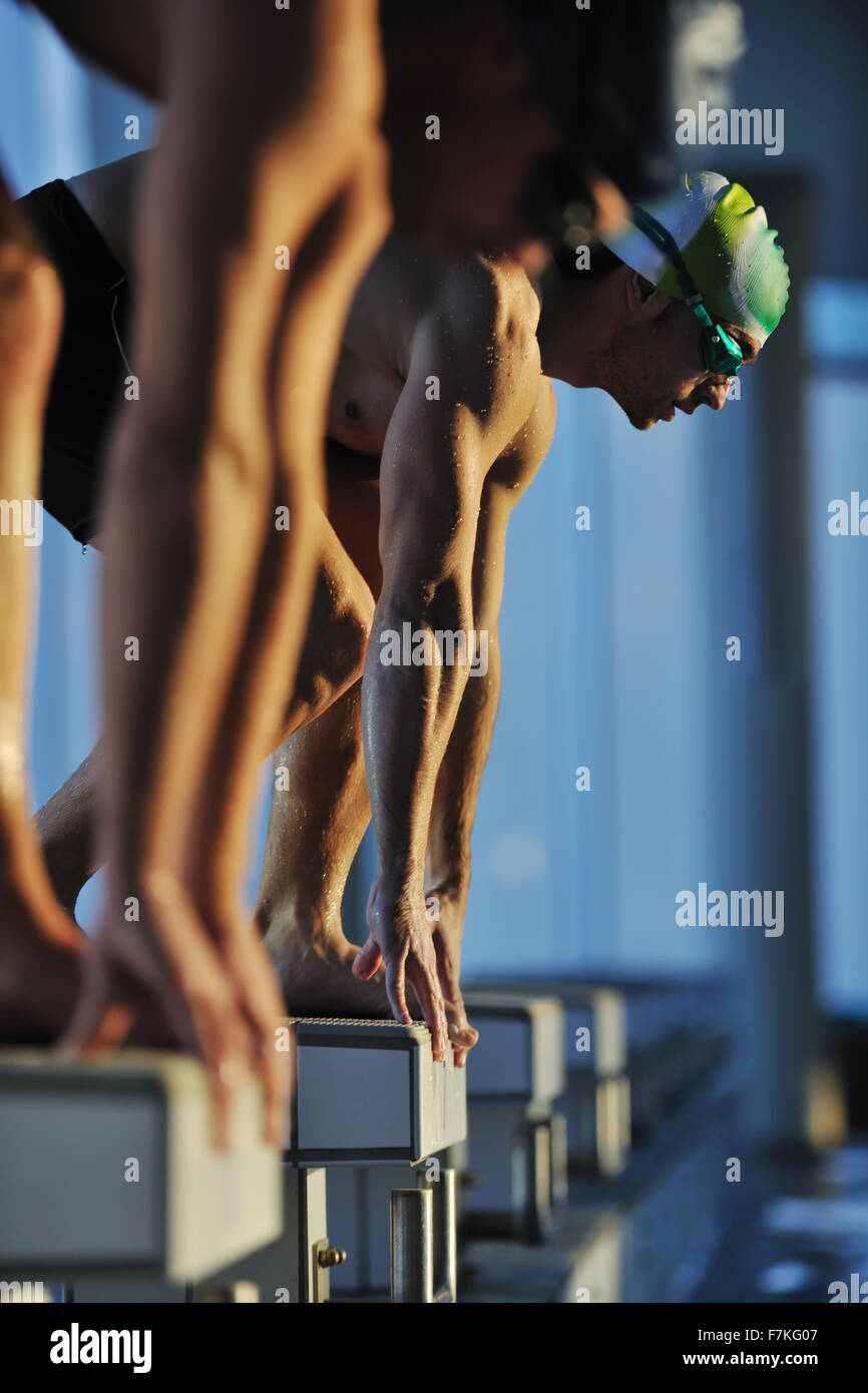 start position race concept with fit swimmer on swimming pool Stock ...
