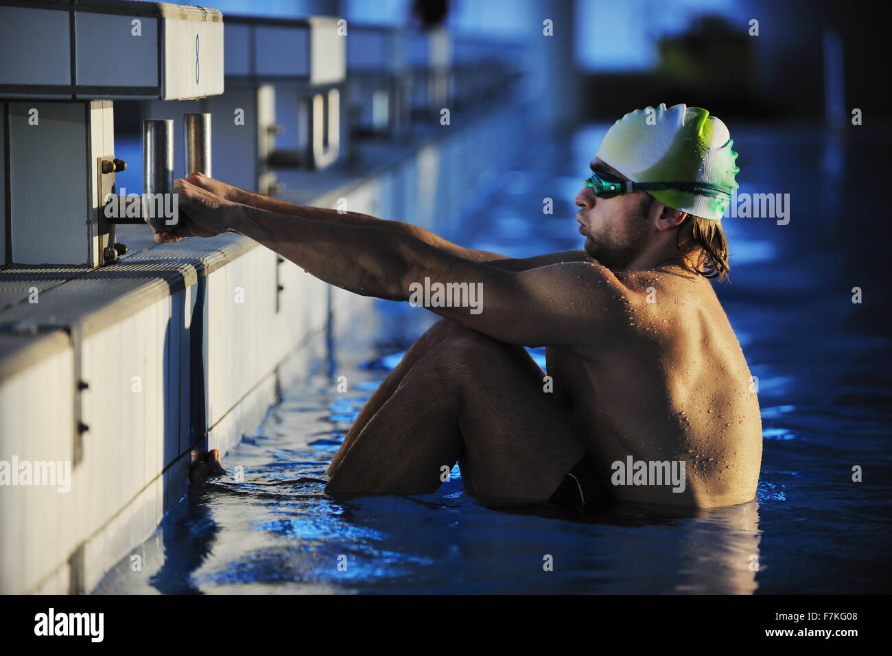 start position race concept with fit swimmer on swimming pool Stock ...
