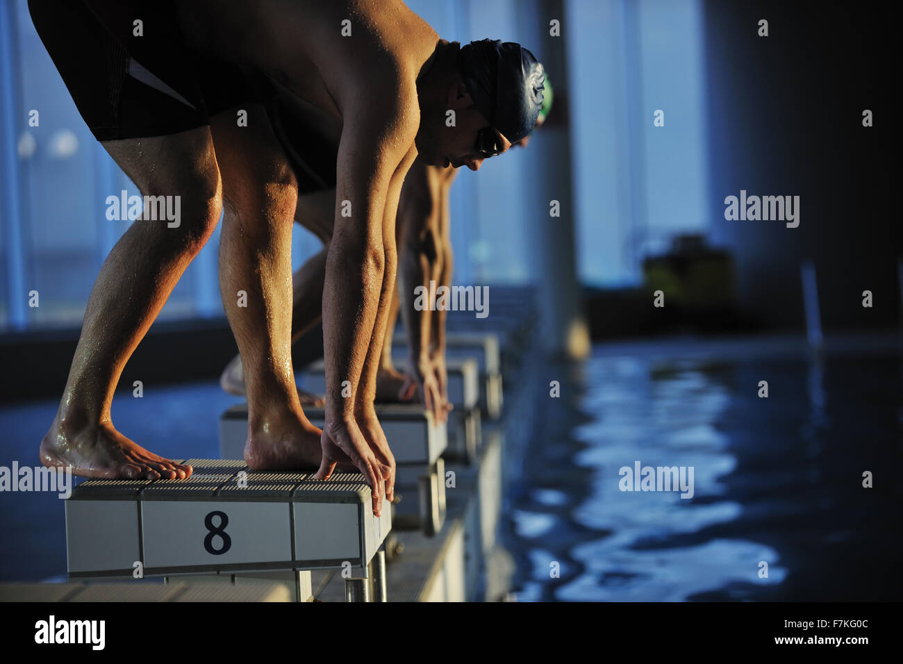 start position race concept with fit swimmer on swimming pool Stock ...