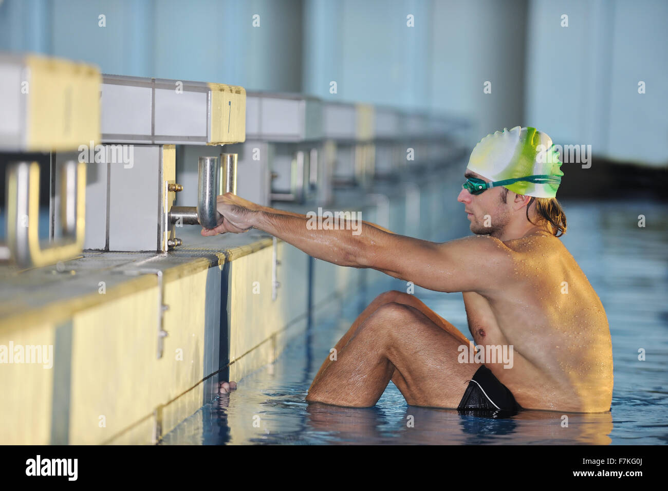 start position race concept with fit swimmer on swimming pool Stock ...