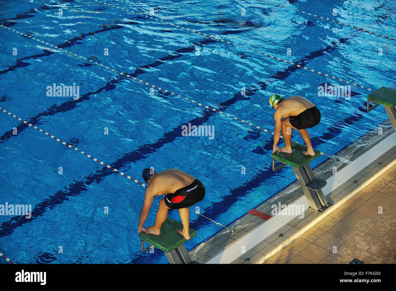 start position race concept with fit swimmer on swimming pool Stock ...