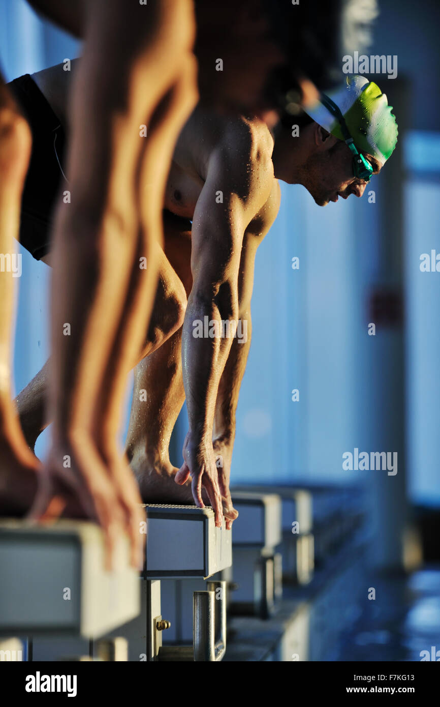 start position race concept with fit swimmer on swimming pool Stock ...