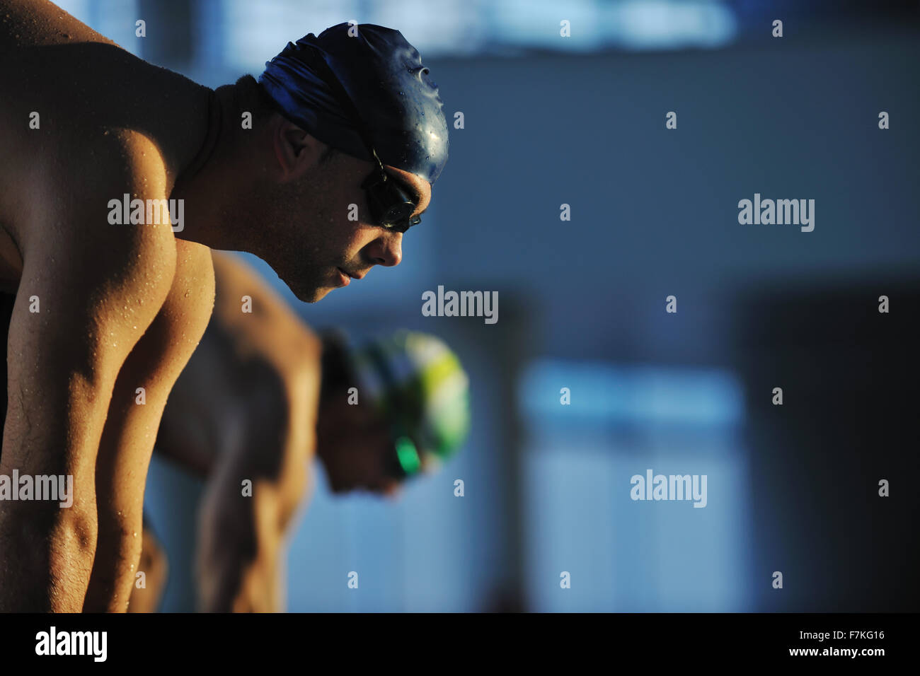 start position race concept with fit swimmer on swimming pool Stock ...