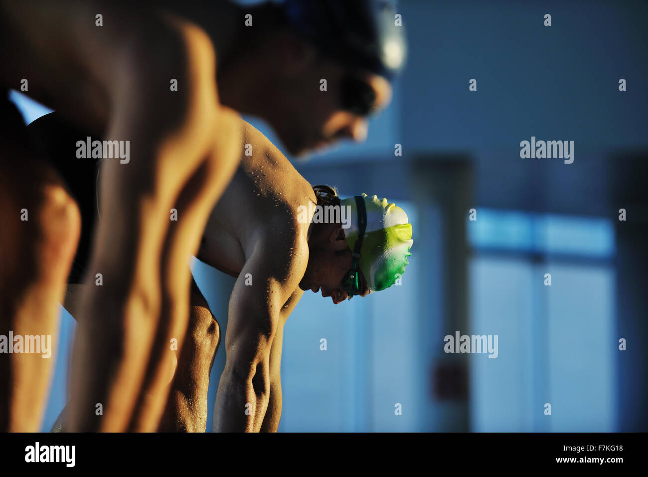 start position race concept with fit swimmer on swimming pool Stock ...