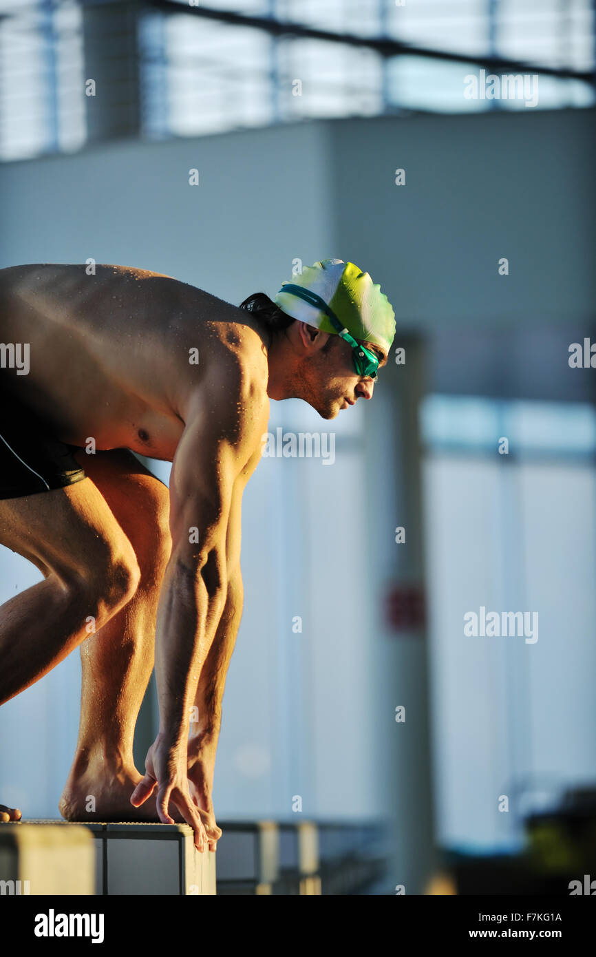start position race concept with fit swimmer on swimming pool Stock ...