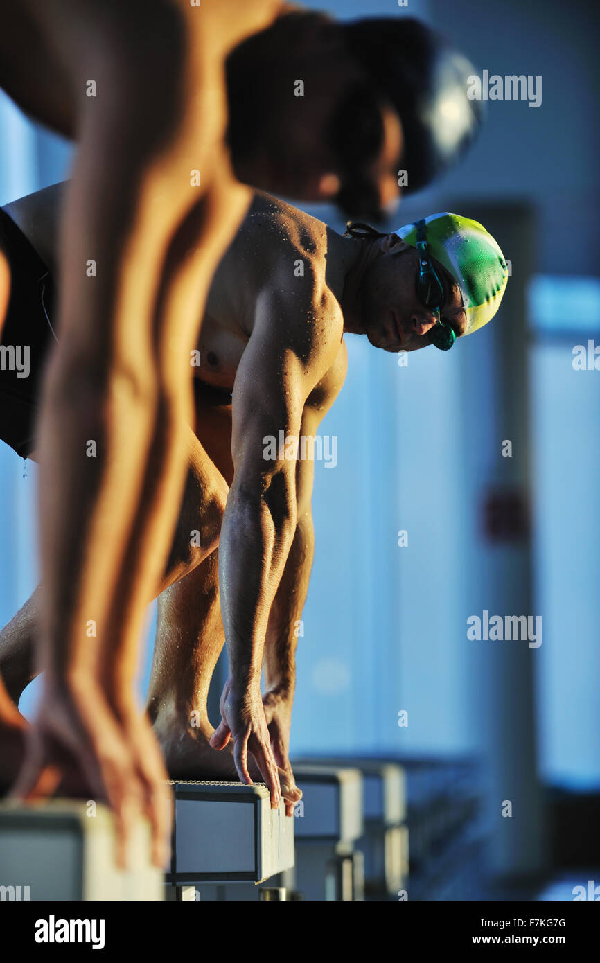start position race concept with fit swimmer on swimming pool Stock ...