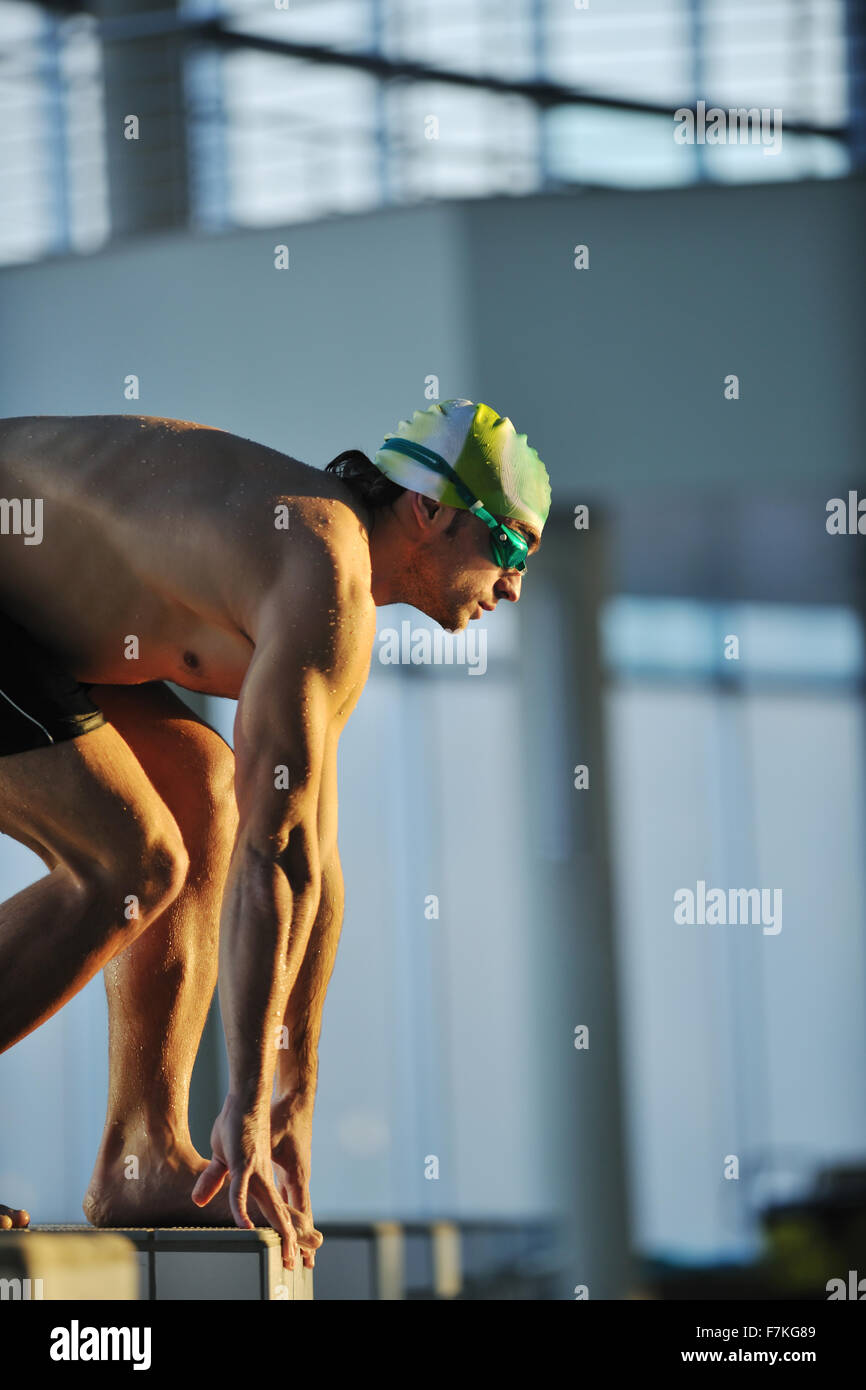 start position race concept with fit swimmer on swimming pool Stock ...