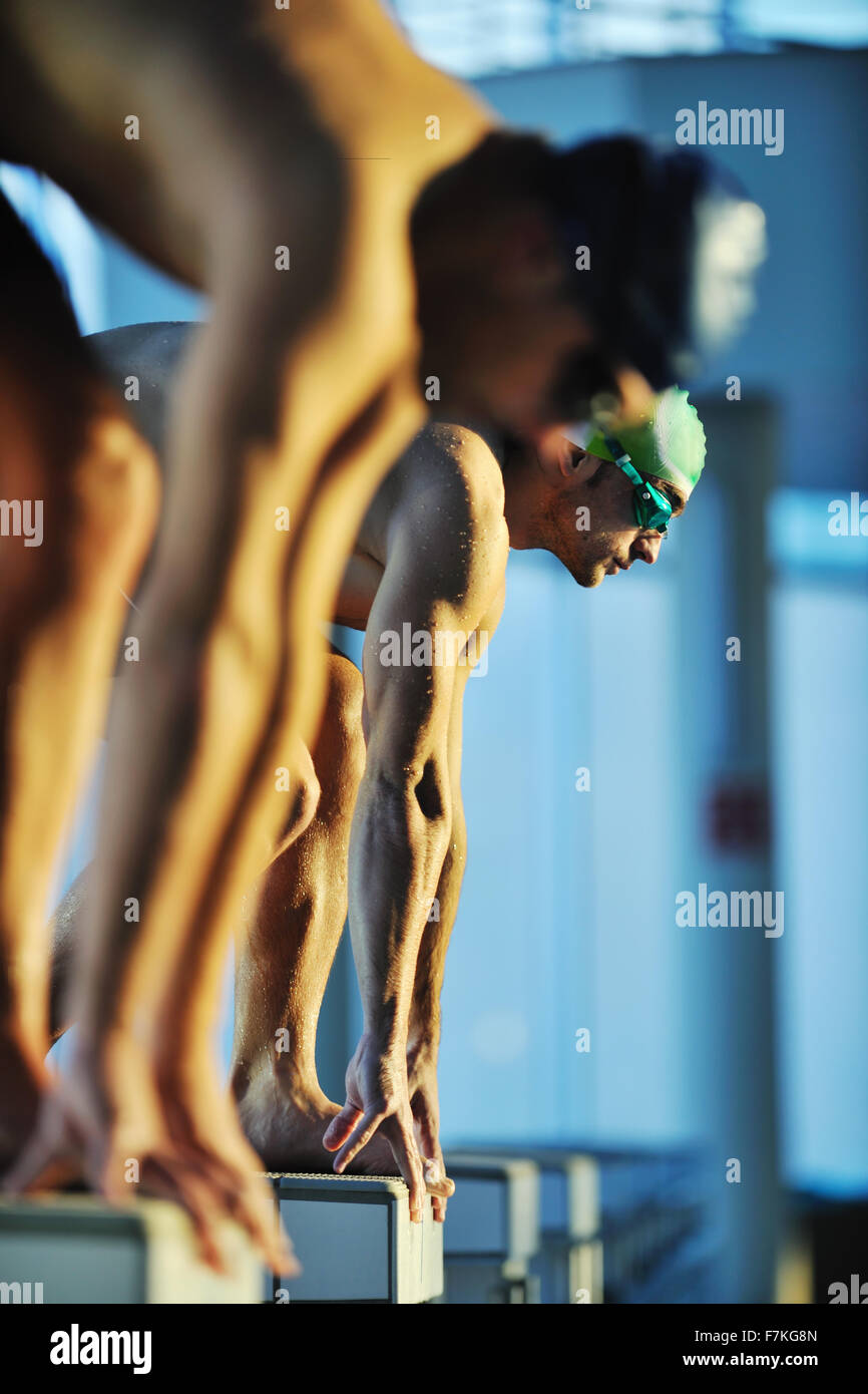 start position race concept with fit swimmer on swimming pool Stock ...