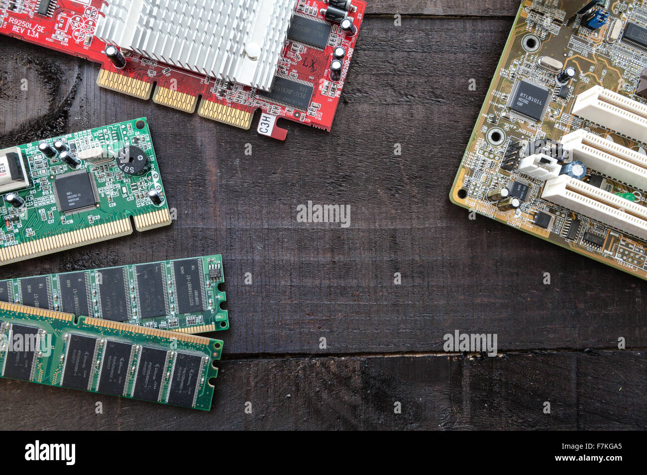 Motherboard and pc components over a wood background for a IOT or ...