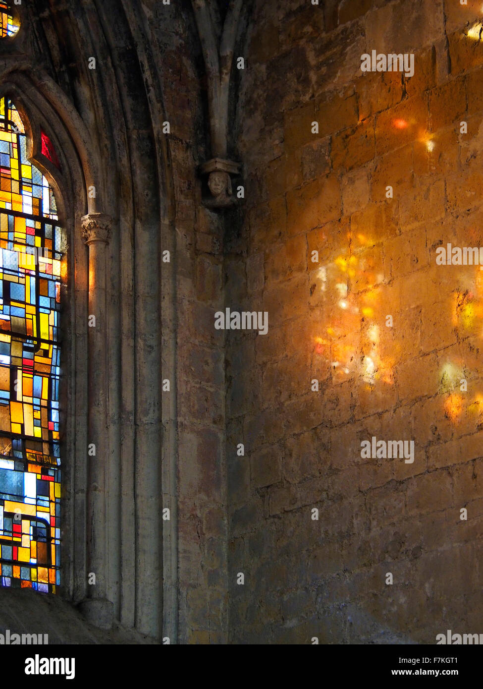 stained glass window and reflections on the wall of St Maurice ...