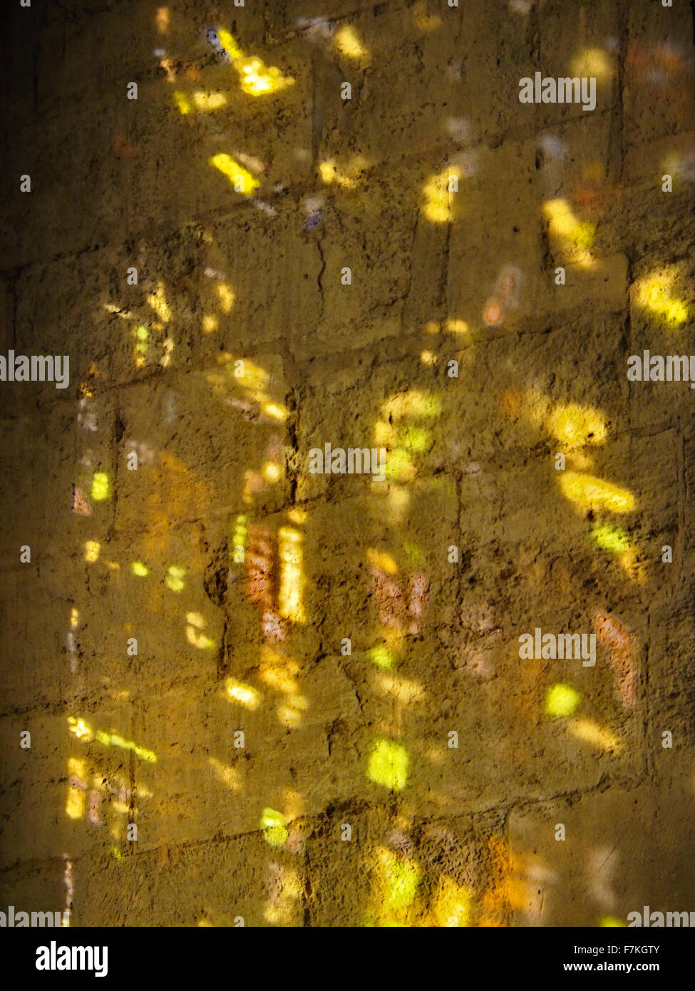 Reflections of stained glass window on the wall of St Maurice Cathedral ...