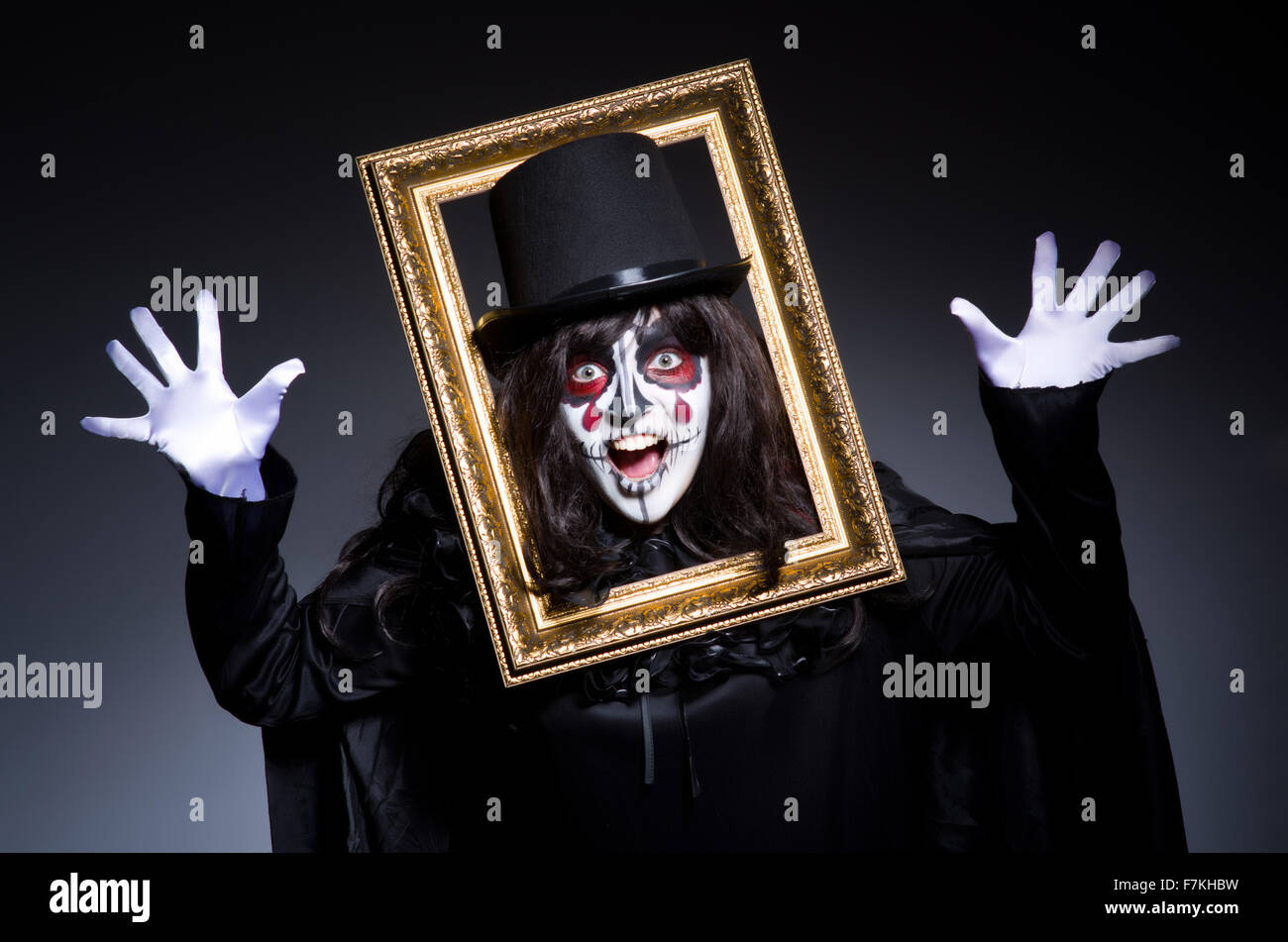 Monster with picture photo frame in dark room0 Stock Photo - Alamy