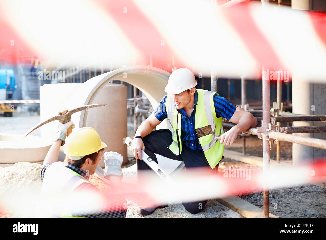 Construction workers talking at construction site Stock Photo - Alamy