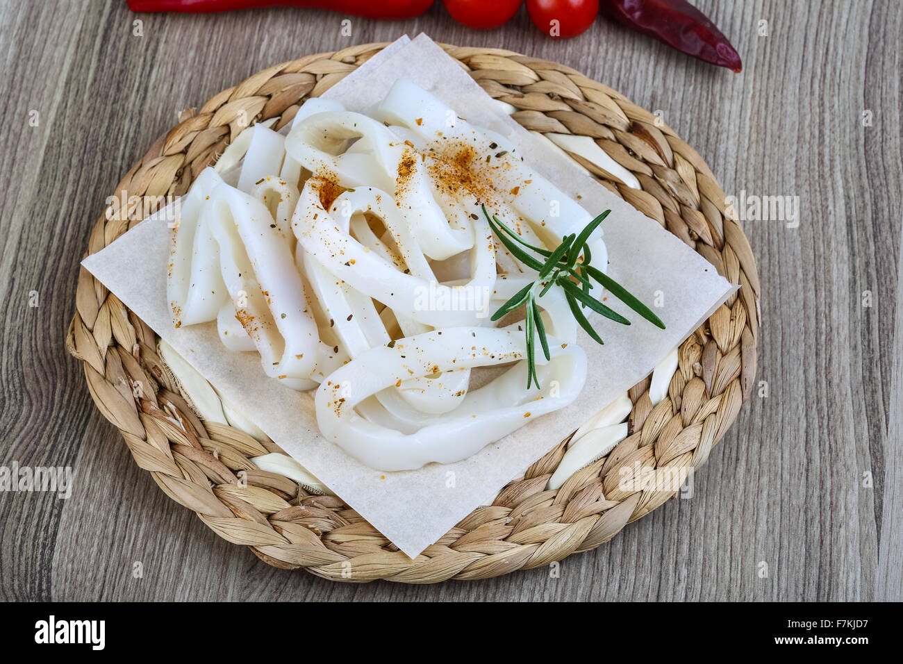 Raw squid rings with herbs - ready for cooking Stock Photo - Alamy