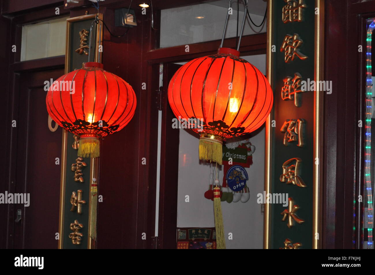 Two bright Chinese lanterns hanging outside a restaurant Stock Photo ...
