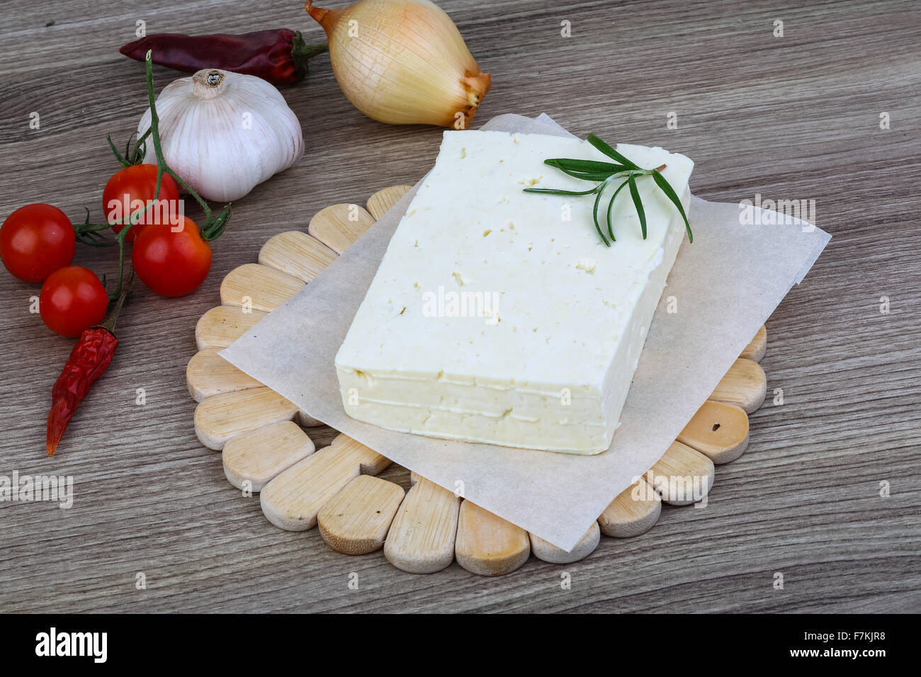 Traditional Caucasian homemade Cheese Brinza with rosemary on wood ...