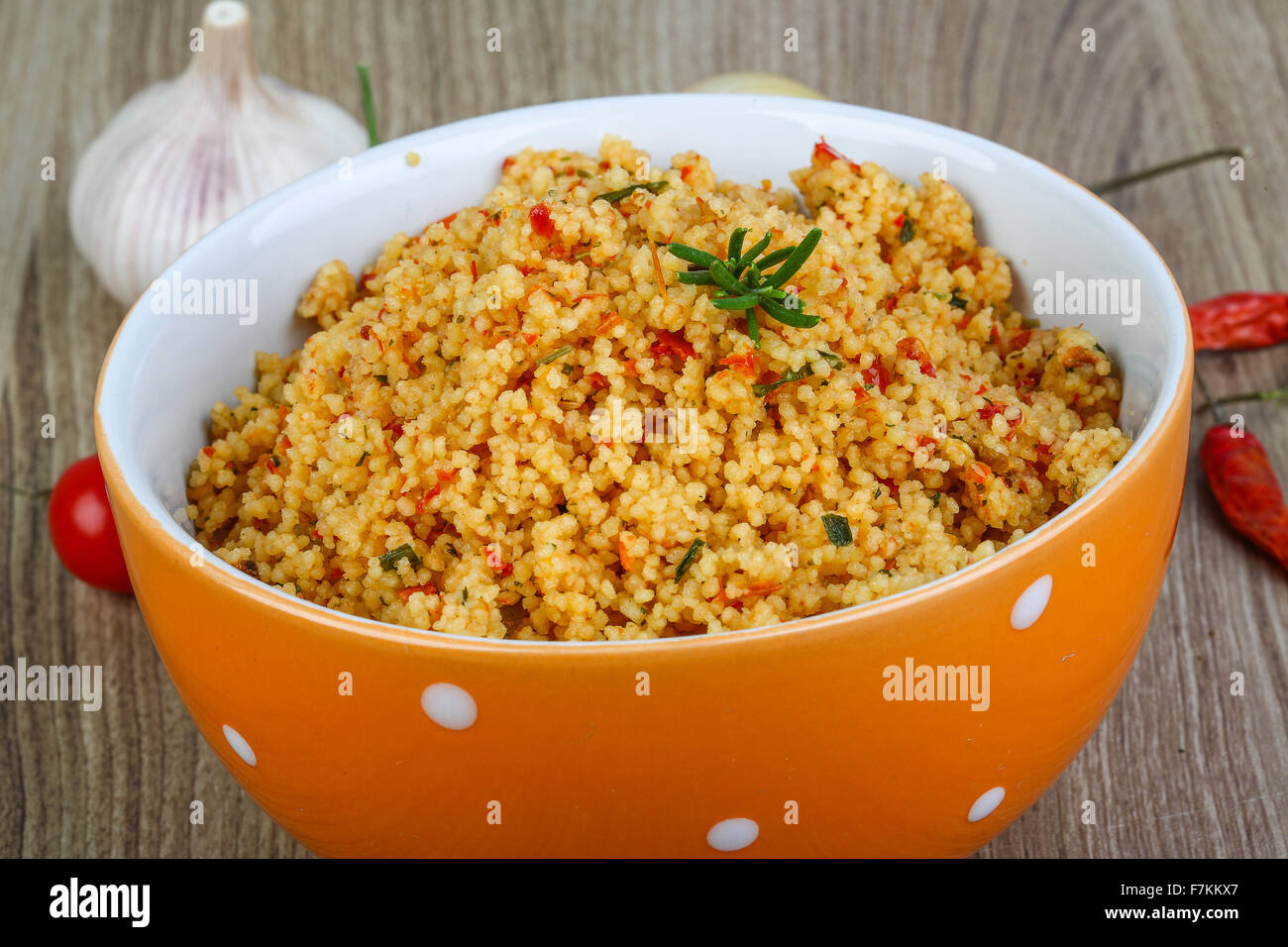 Arabic traditional cuisine - Couscous with tomato and green onion Stock ...