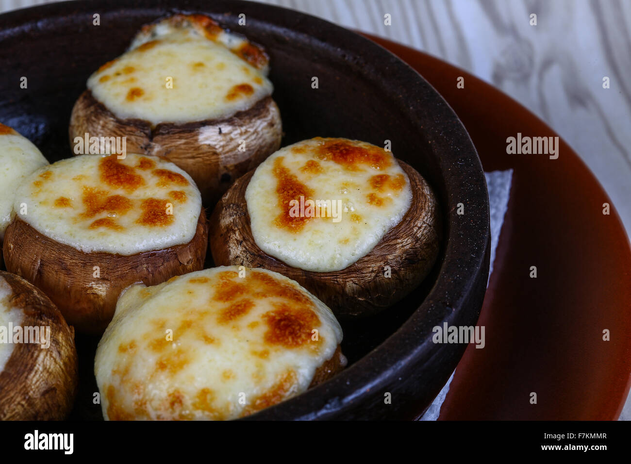 Baked Stuffed champignon with hard cheese and spices Stock Photo - Alamy
