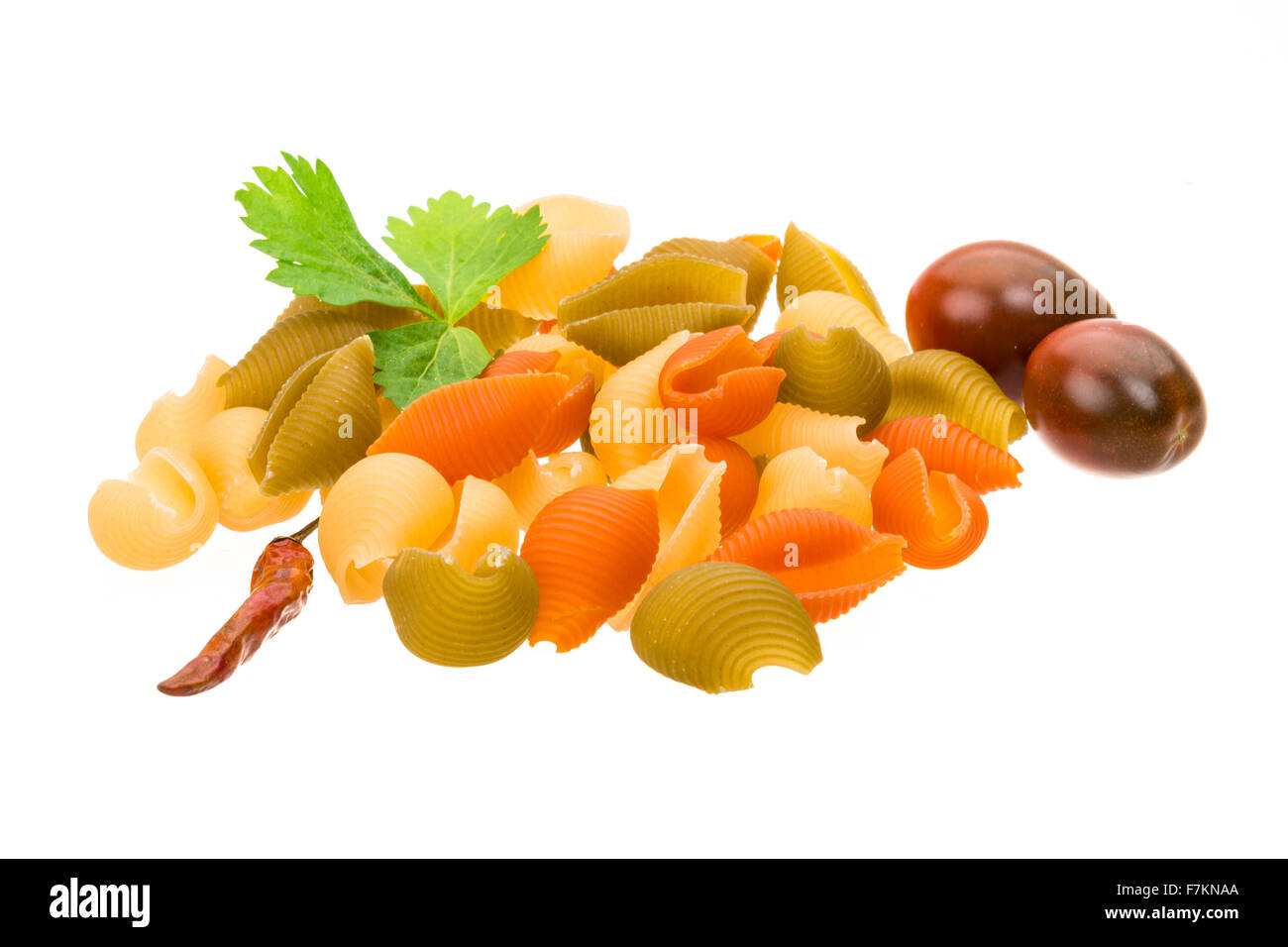 Macaroni - various color with herbs and tomato Stock Photo - Alamy