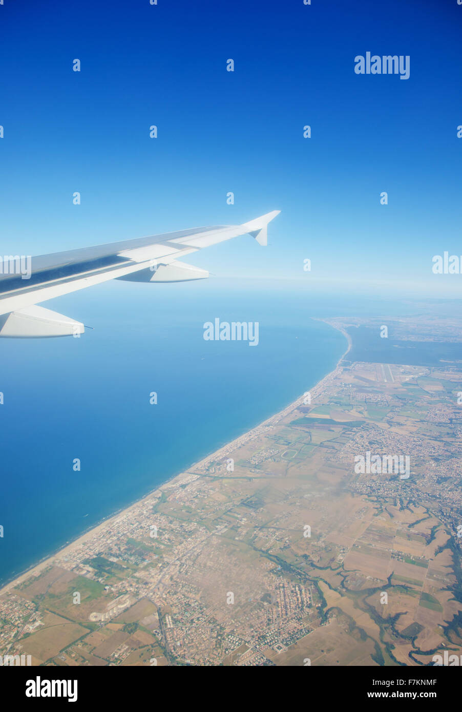 Airplane wing out of window Stock Photo - Alamy