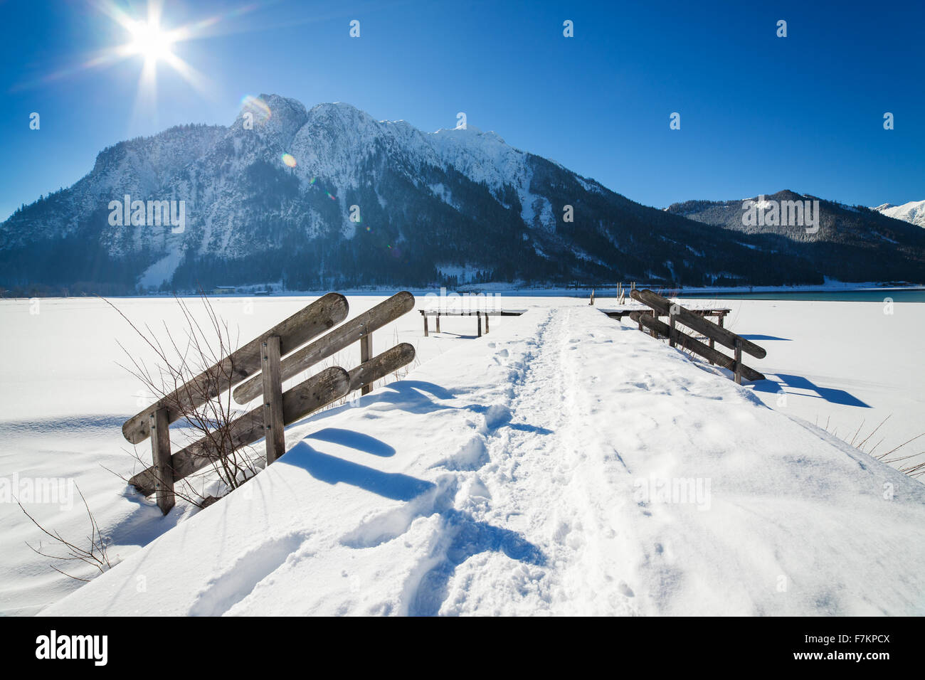 Mountain winter landscape with wooden stairs covered with snow near ...