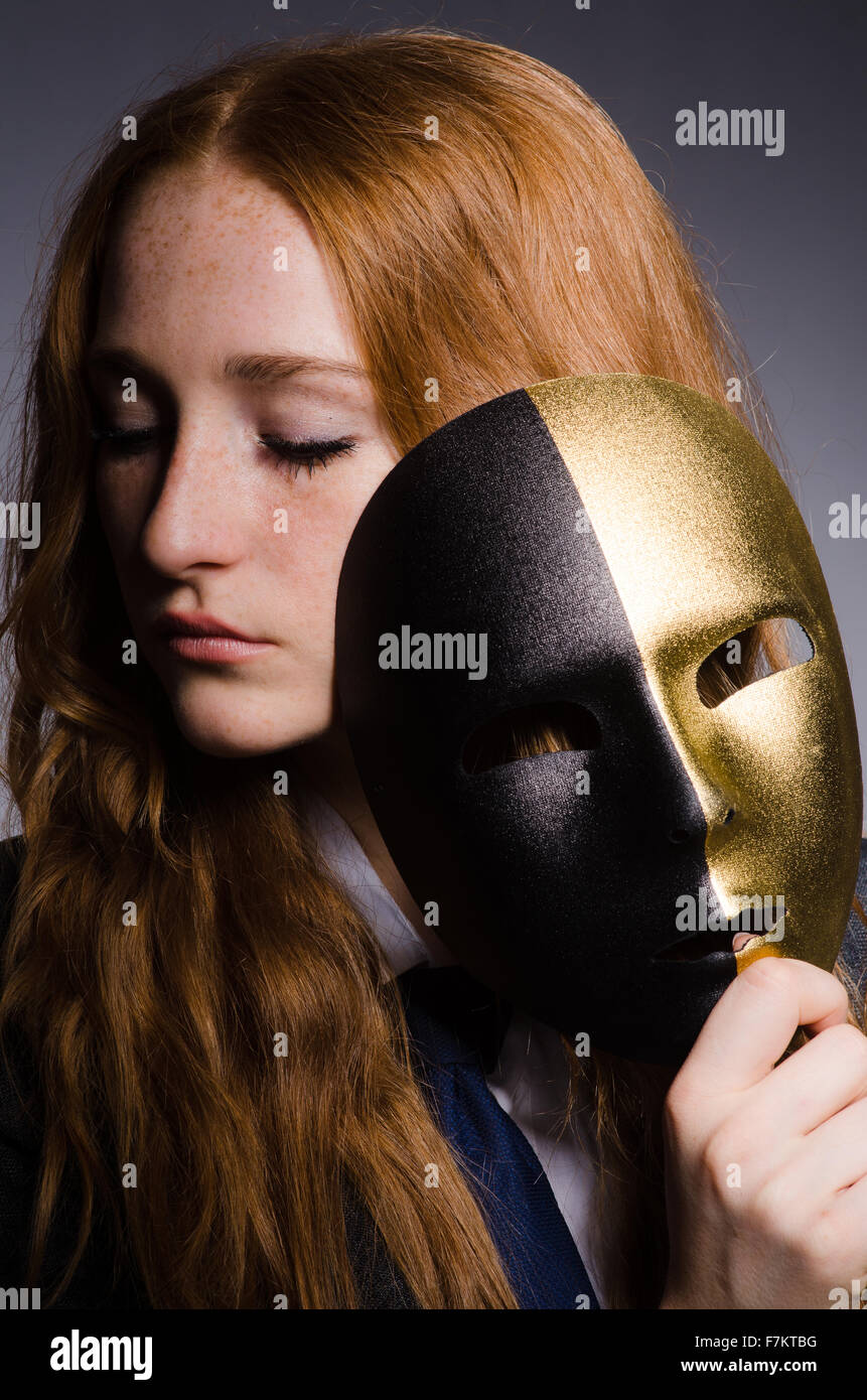 Woman with mask in hypocrisy concept Stock Photo - Alamy