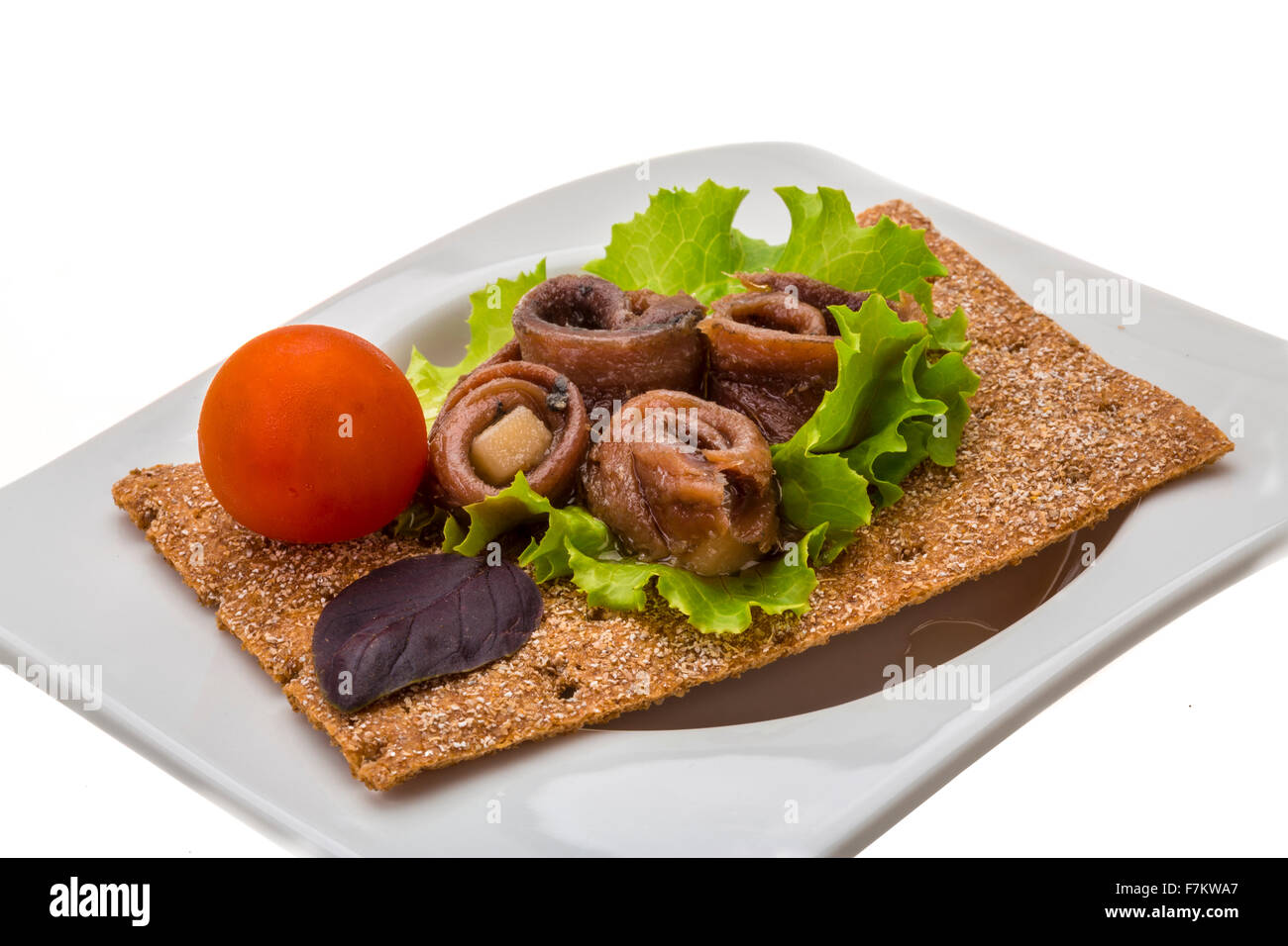 Anchovy snack with salad and tomato Stock Photo - Alamy